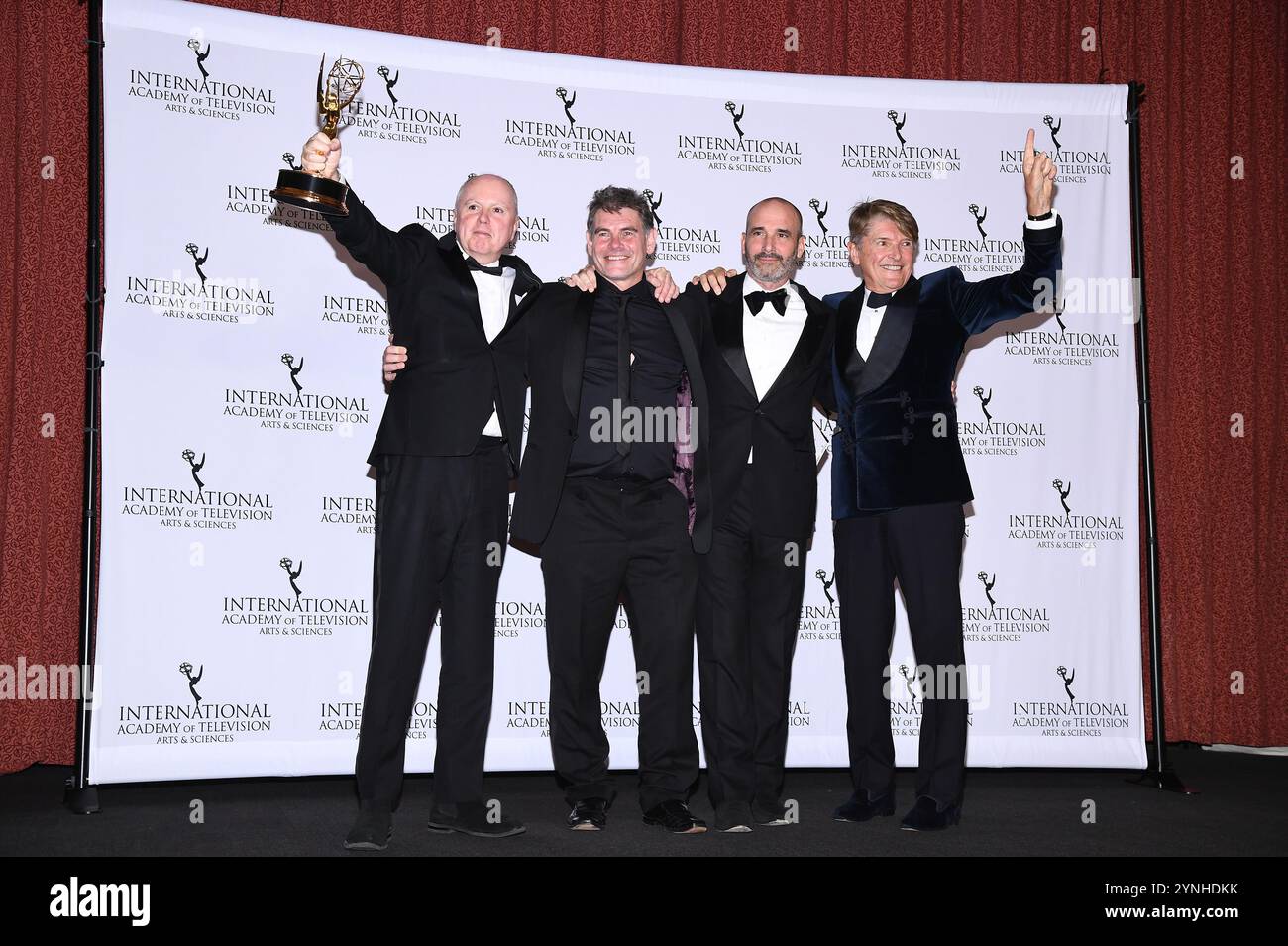 Producer Neil Duncanson (L) and Simon Hammerson (2R) pose with the ...