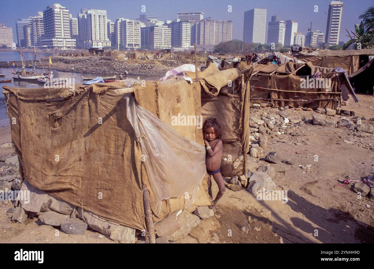 India, Bombay, Slum along the harbor. Fisherman families have their ...