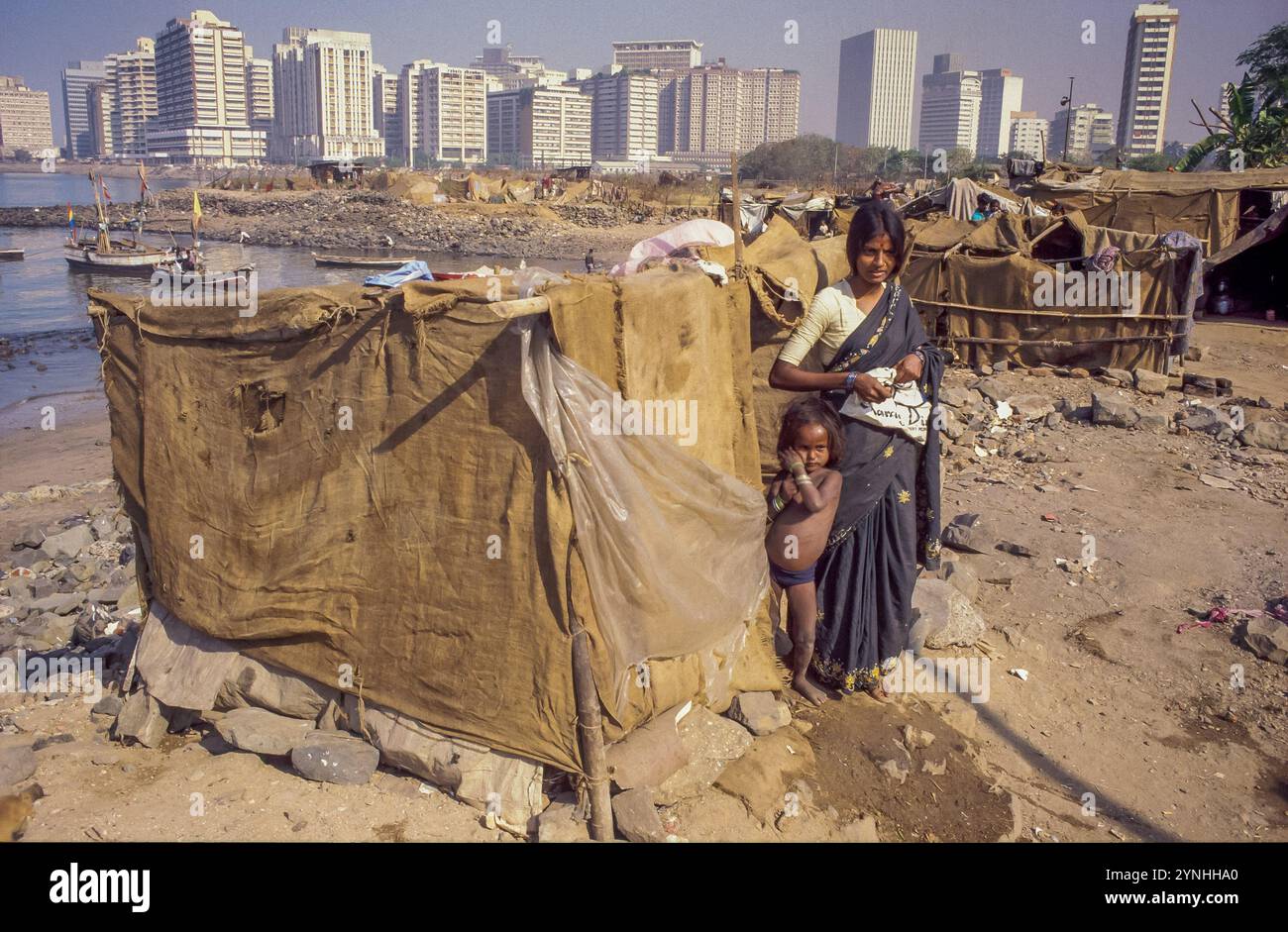 India, Bombay, Slum along the harbor. Fisherman families have their ...