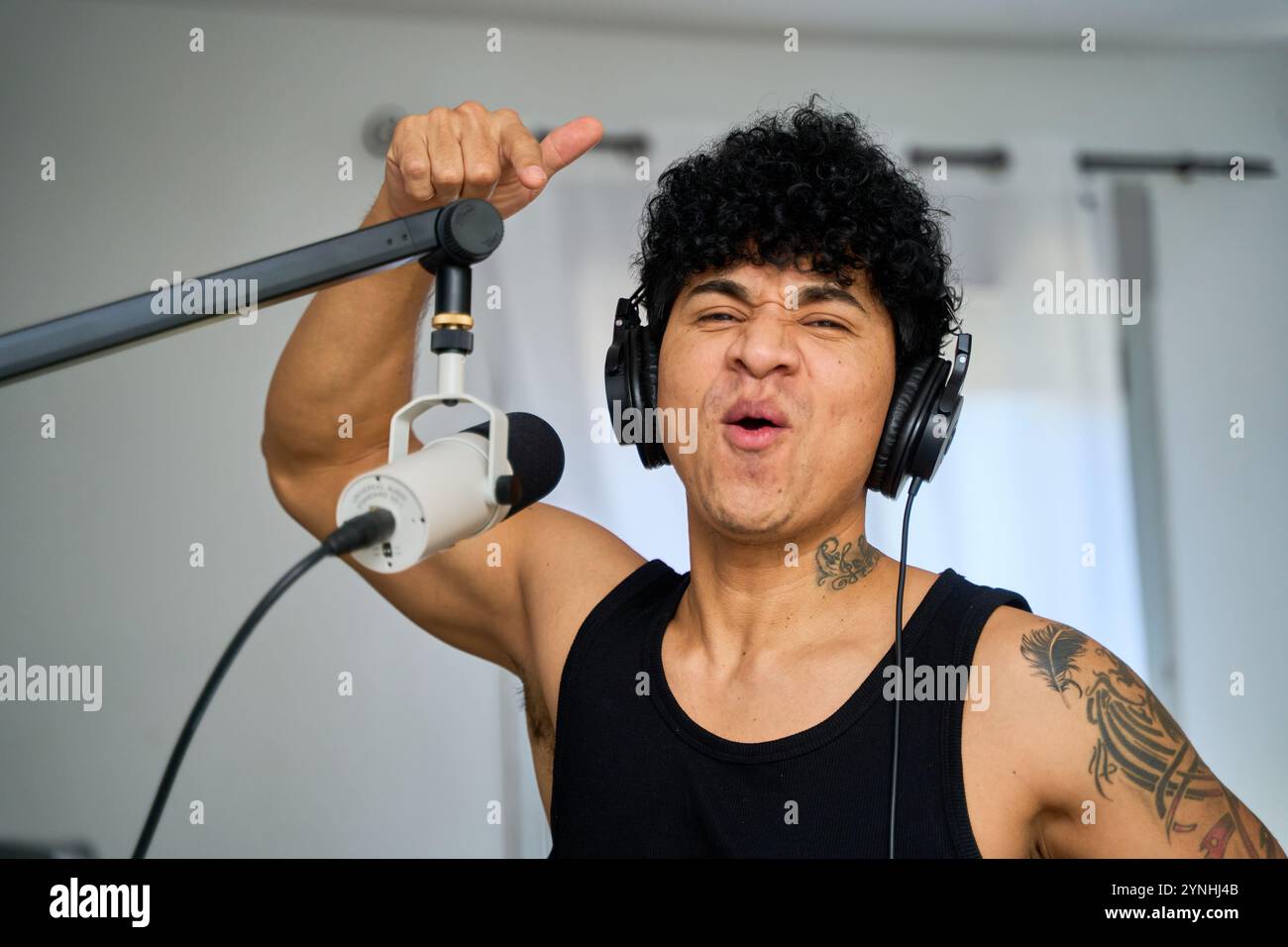 Happy man recording song hi-res stock photography and images - Alamy