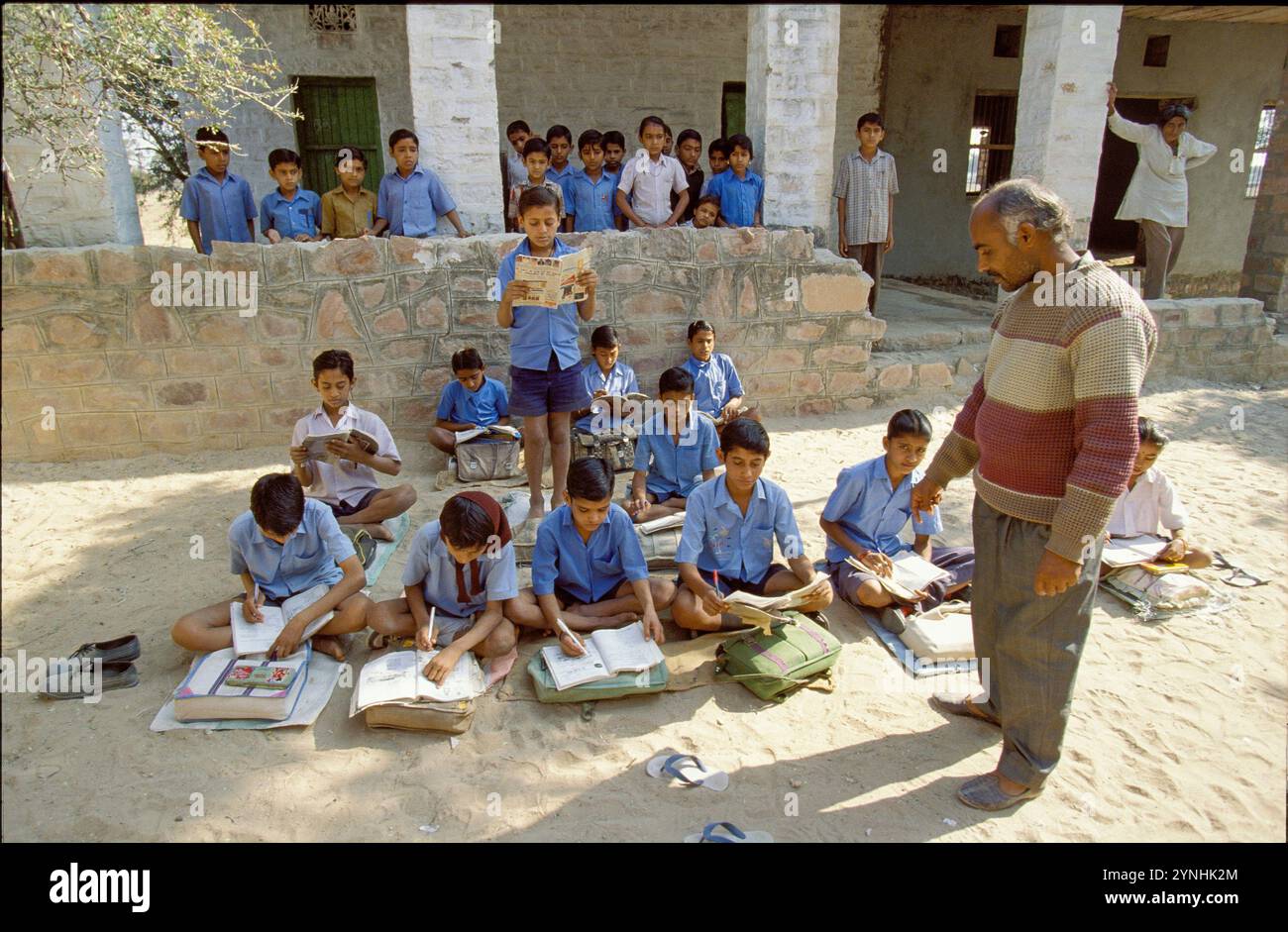 India, Rajasthan, Jodhpur, primary school Teacher teaches outdoors ...