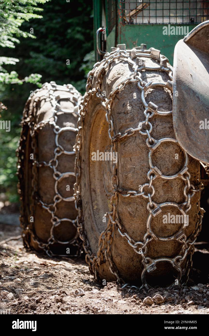 Giant wheels equipped with chains for mud Stock Photo - Alamy