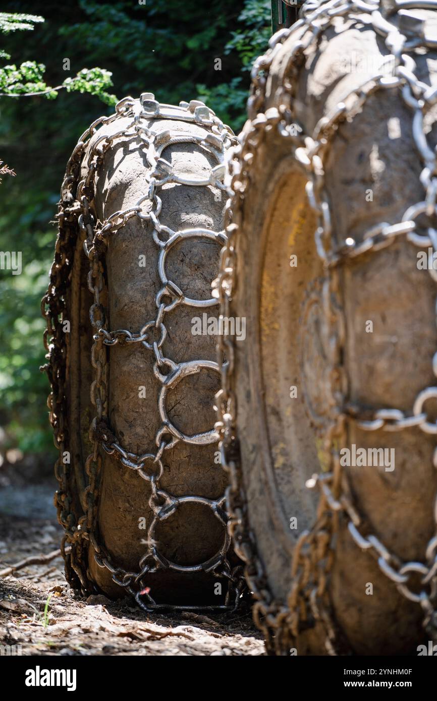 Giant wheels equipped with chains for mud Stock Photo - Alamy