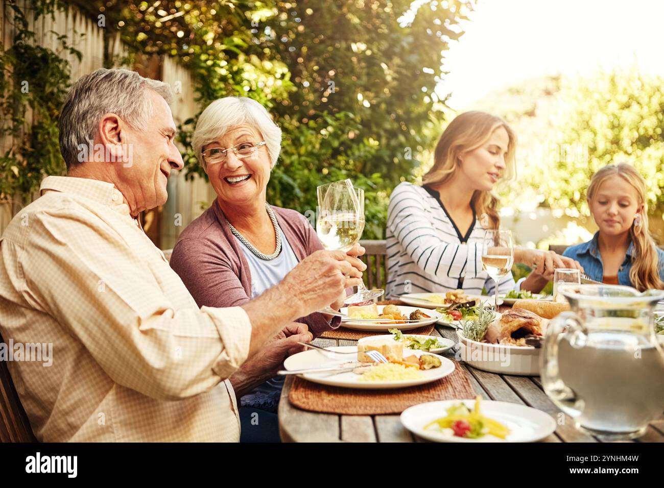 Grandparents, family and toast with wine, lunch together and home ...