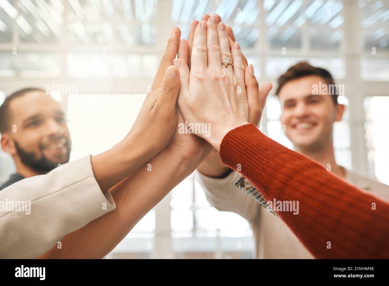 Business people, high five and office to celebrate goals, motivation and collaboration success ...