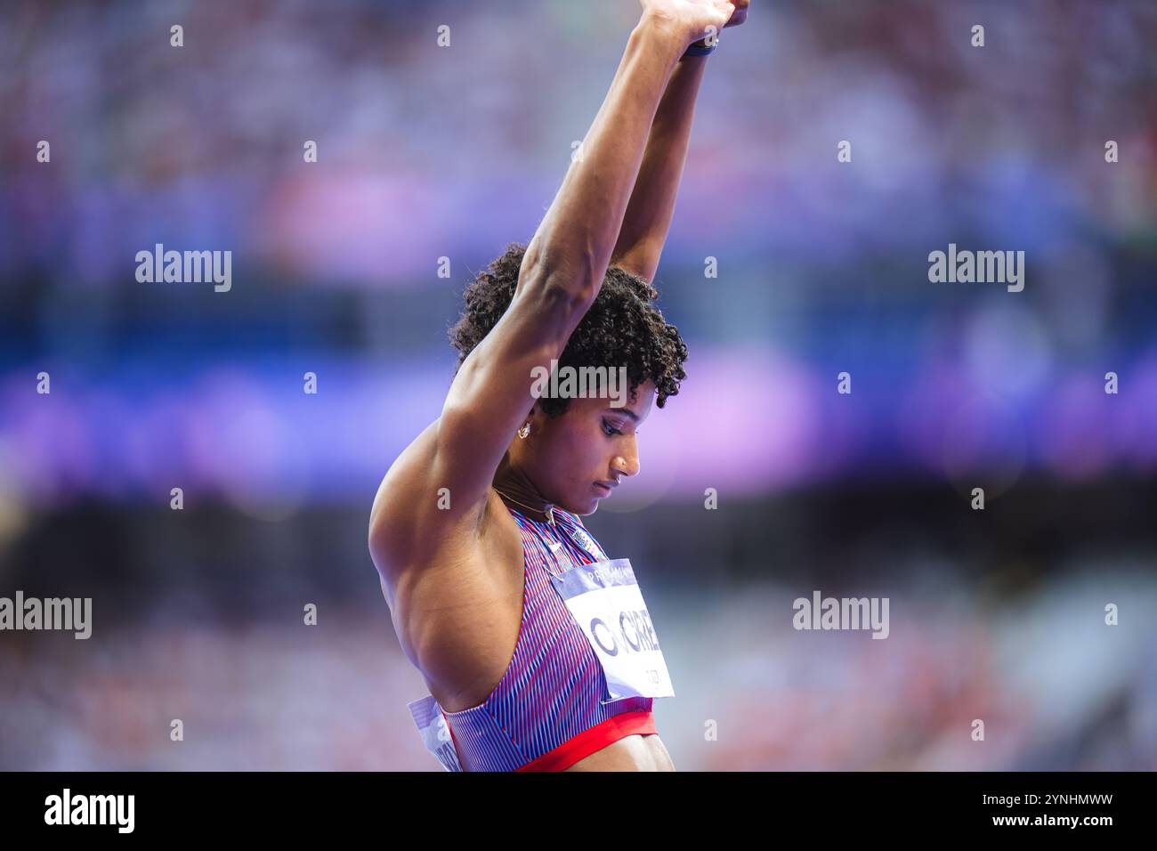 Anna Cockrell participating in the 400 meters hurdles at the Paris 2024 ...