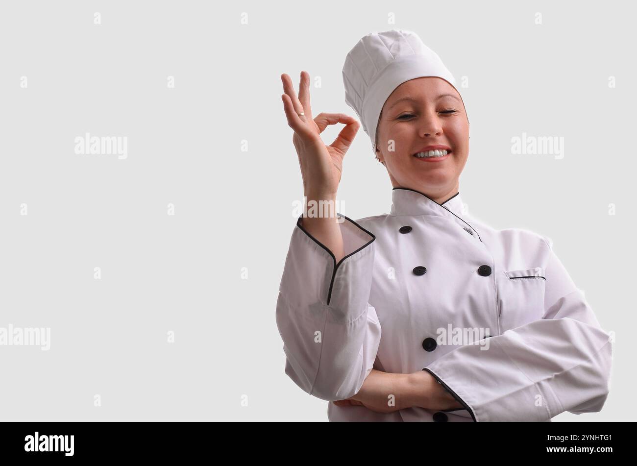 Happy chef making ok sign with fingers while smiling and winking ...