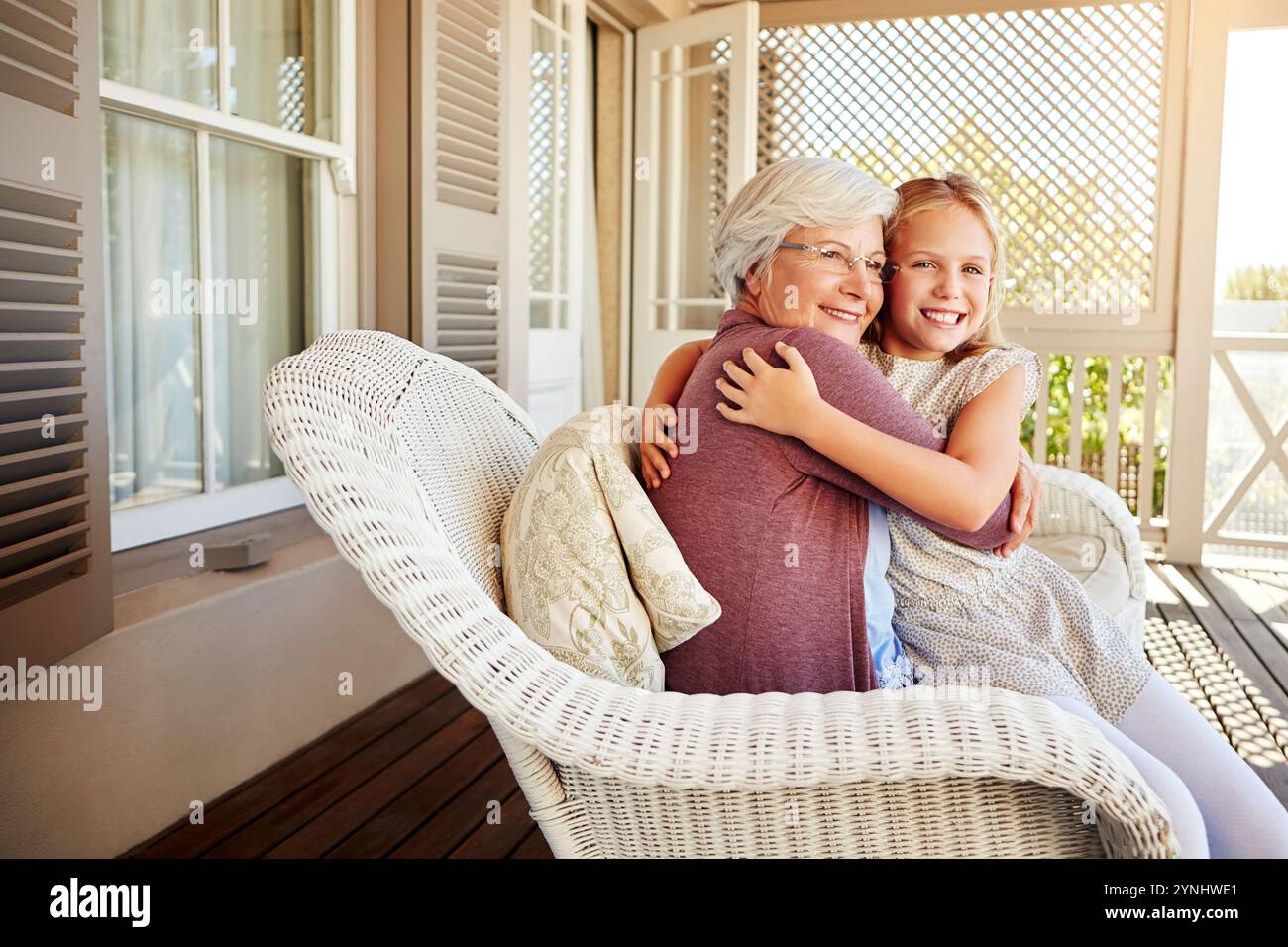 Girl, grandma and hug by house for love, relax and bonding with support ...