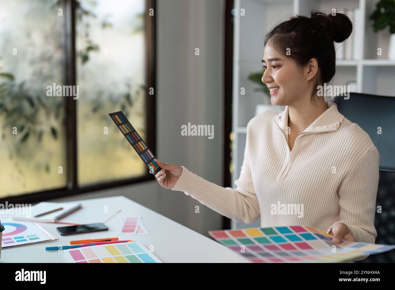 Creative Graphic Designer Working with Color Palettes in Modern Office ...