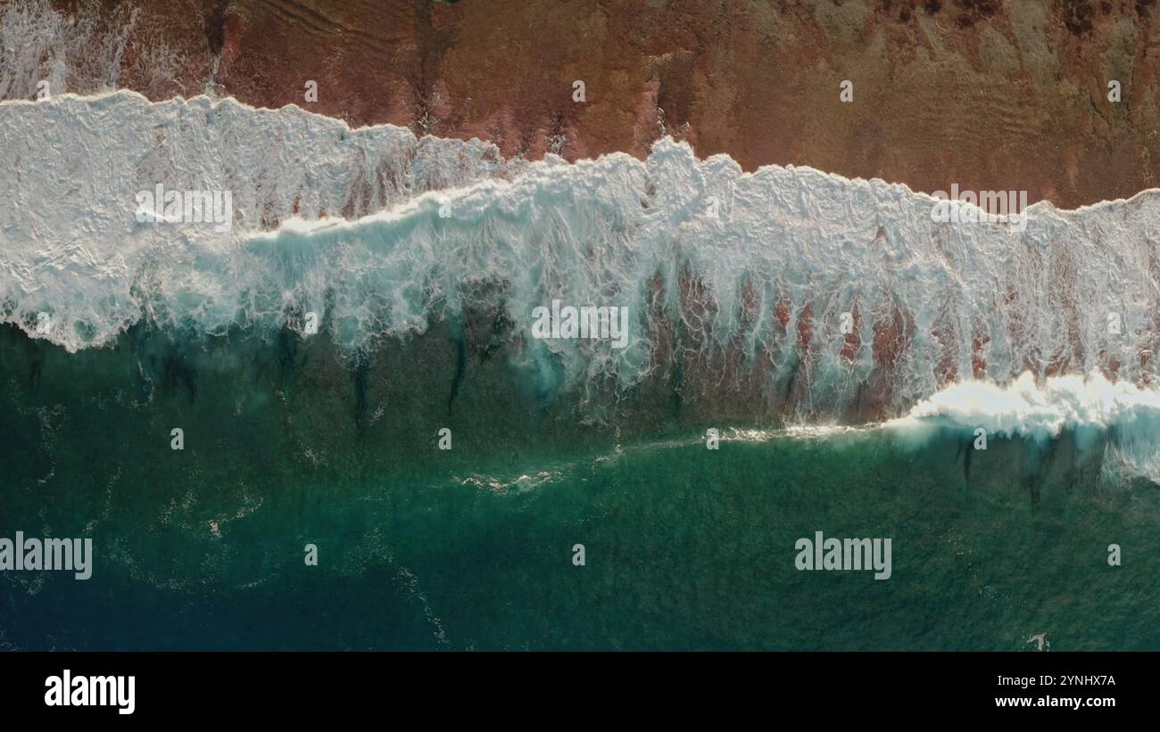 Dramatic green water waves crashing on sand beach coast. The stunning ...
