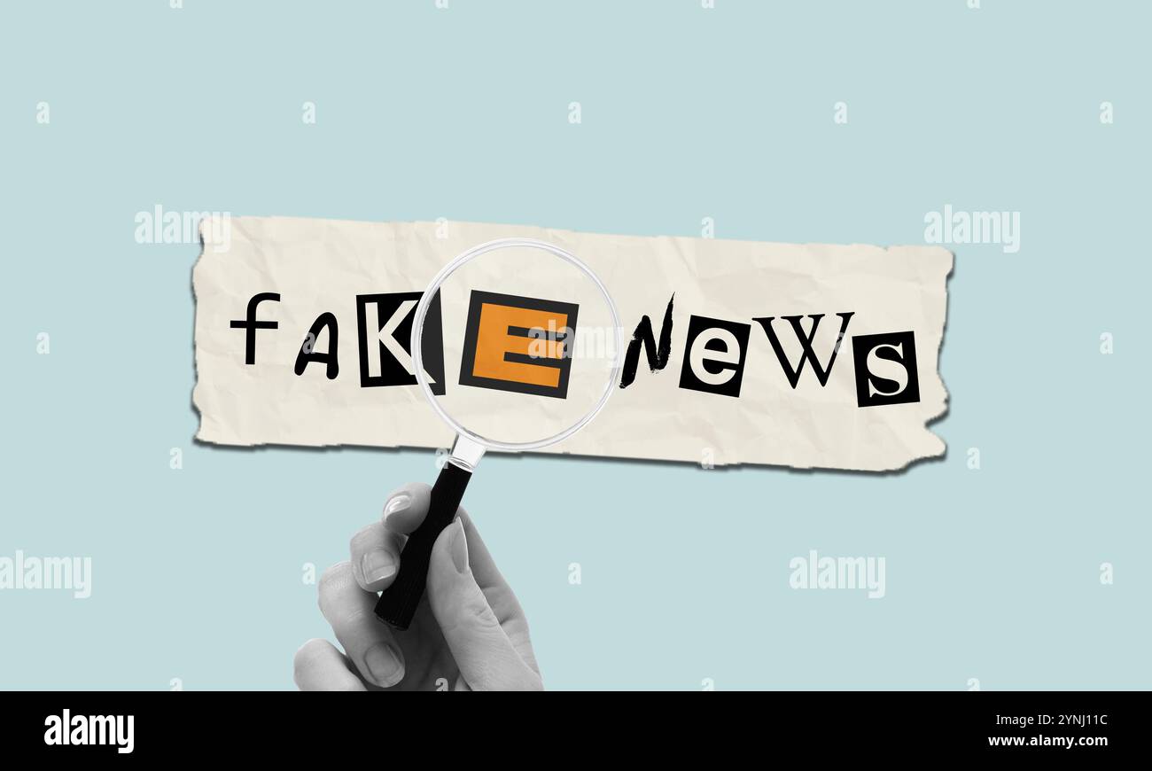 Hand holding magnifying glass above fake news letter collage on torn ...