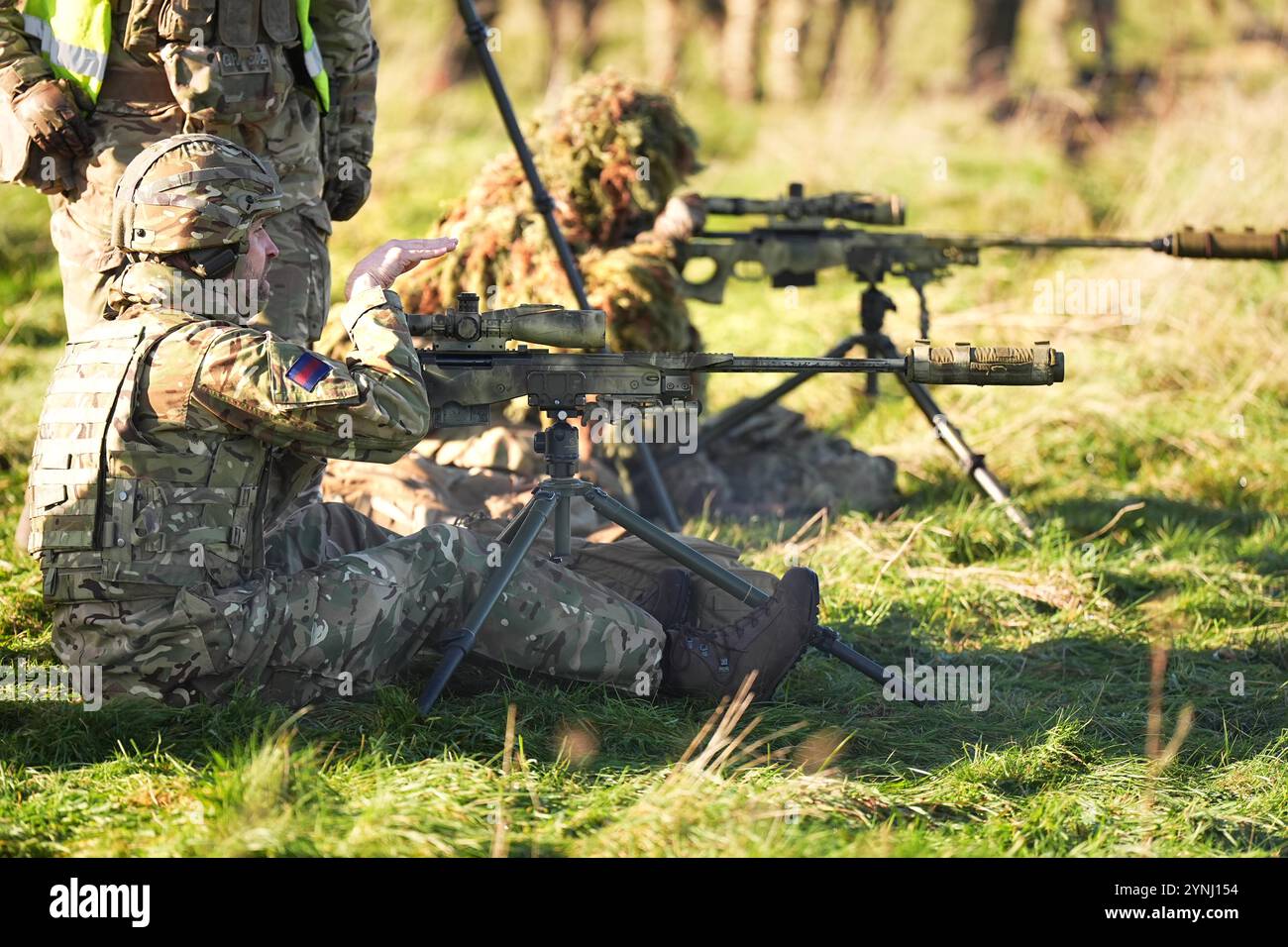 The Prince of Wales, Colonel of the Welsh Guards, using a sniper rifle ...