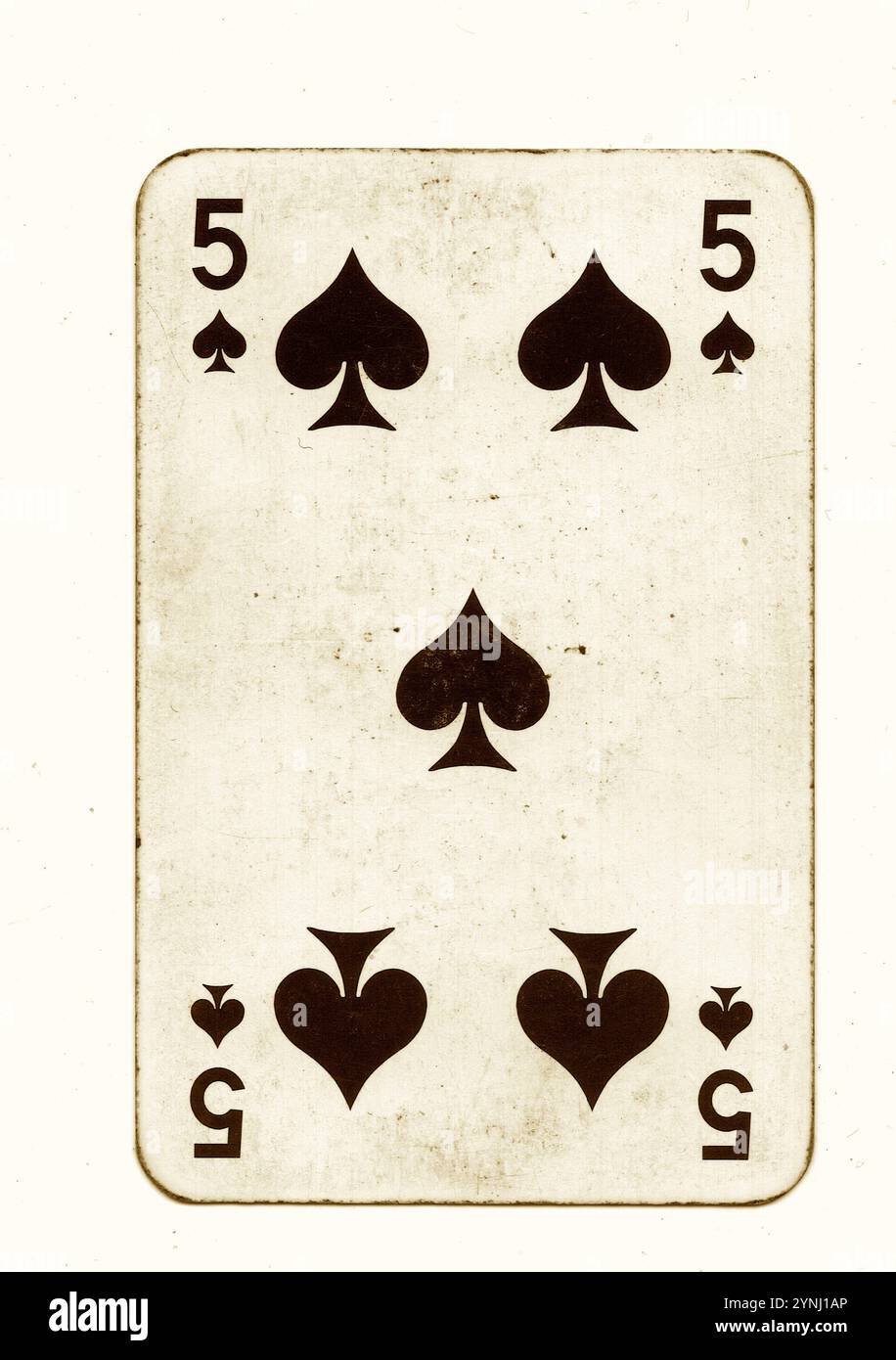 A vintage five of spades playing card in sepia isolated on a white ...