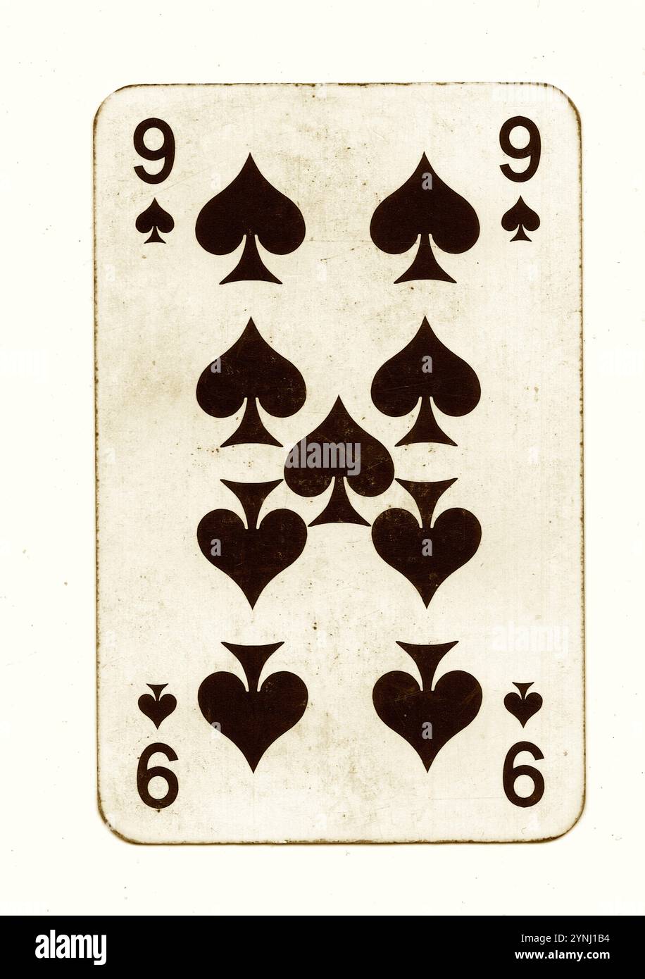 A vintage nine of spades playing card in sepia isolated on a white ...
