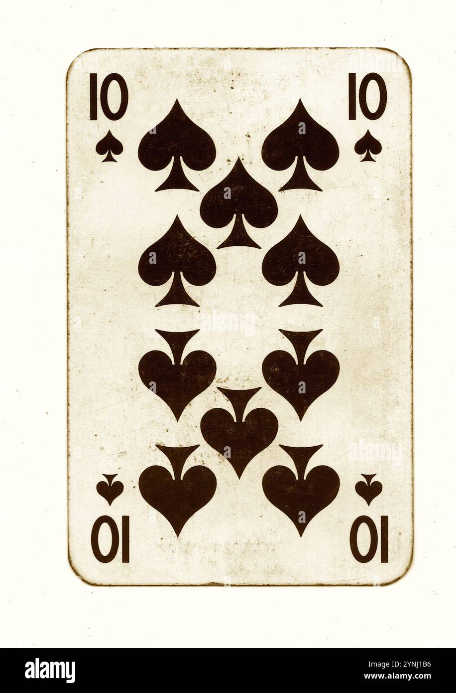 A vintage ten of spades playing card in sepia isolated on a white ...