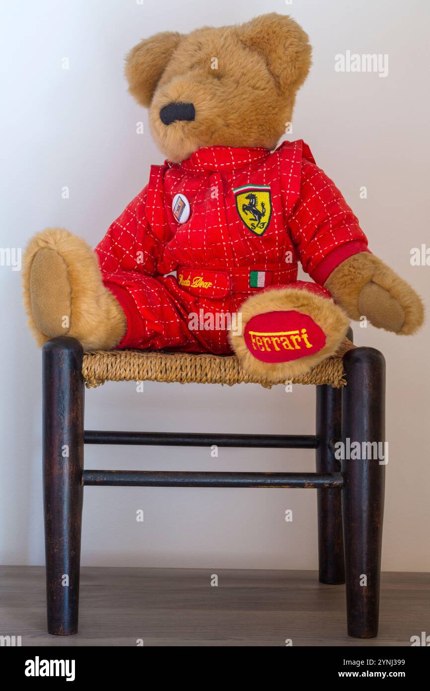 Ferrari Teddy Bear soft cuddly toy sitting on stool Stock Photo - Alamy