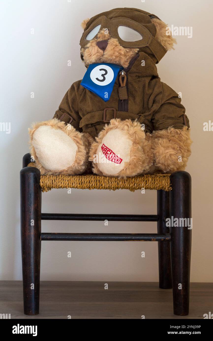 Vintage Racing Jaguar Teddy Bear soft cuddly toy sitting on stool Stock ...