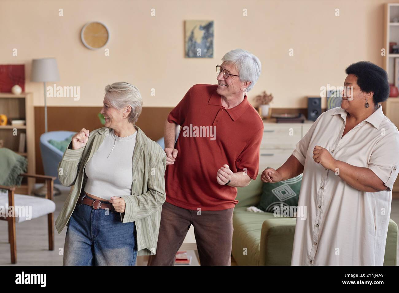 Group of joyful senior people dancing together enjoying disco in ...
