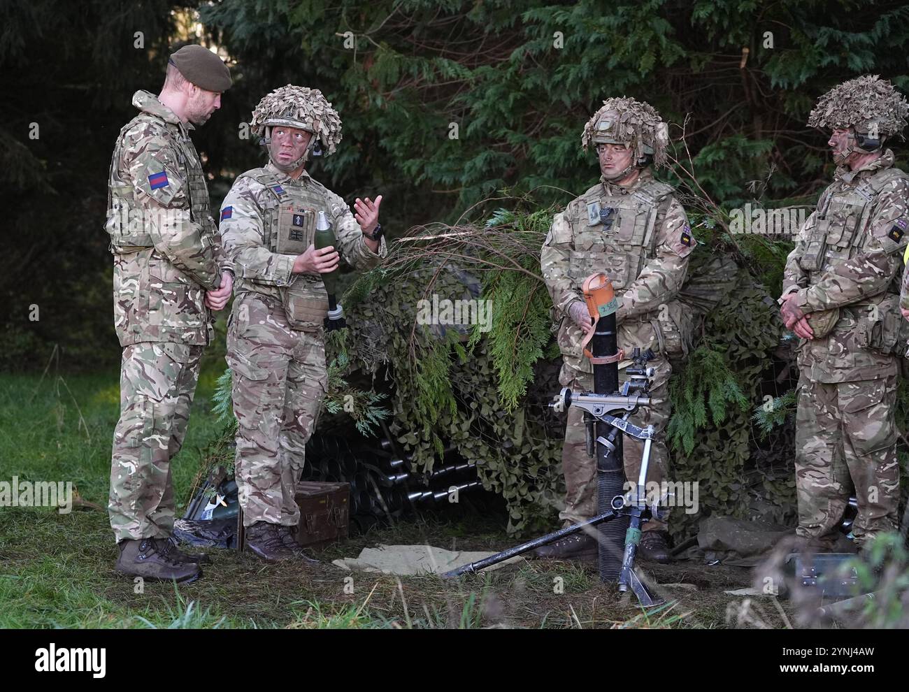 The Prince of Wales, Colonel of the Welsh Guards, (left) is shown an 81 ...
