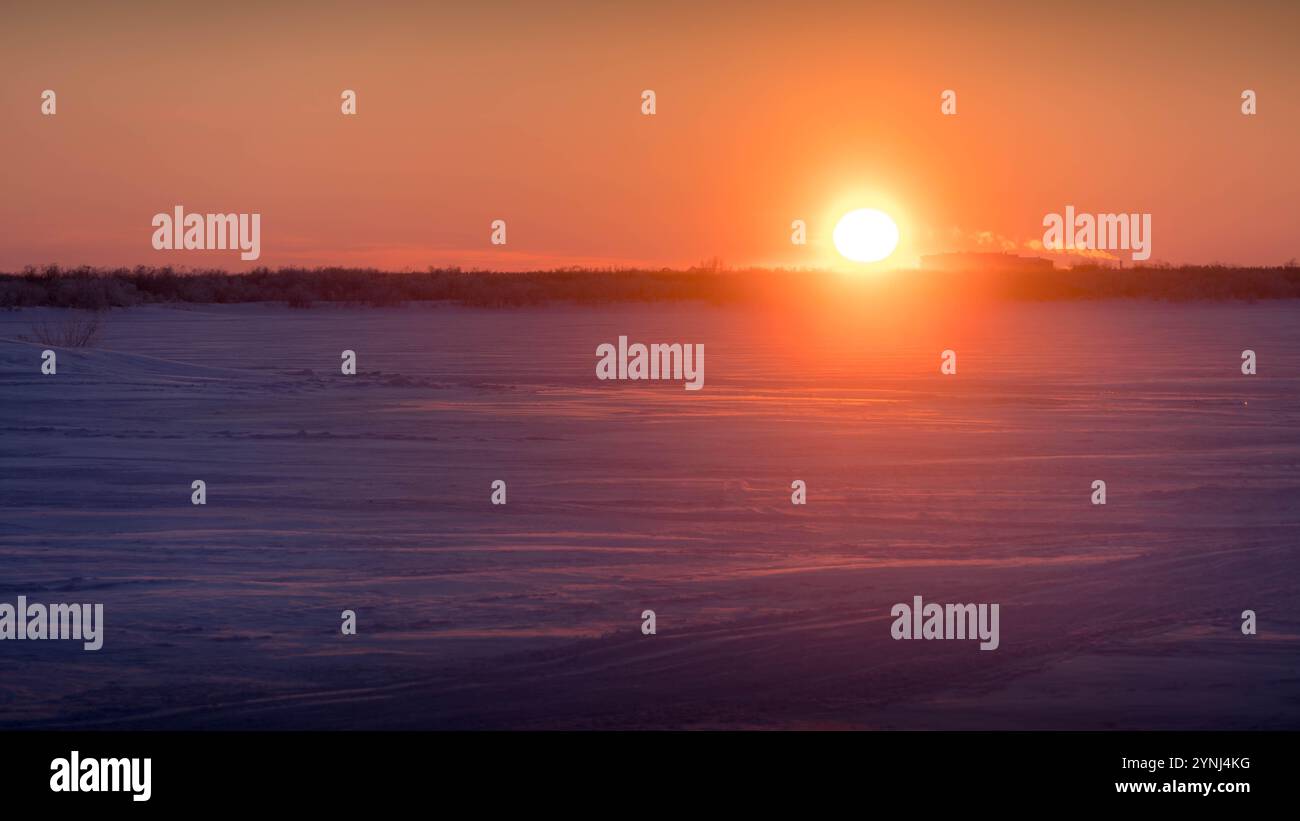 The majestic winter sunset in Russian Arctic, with vast snow-covered ...