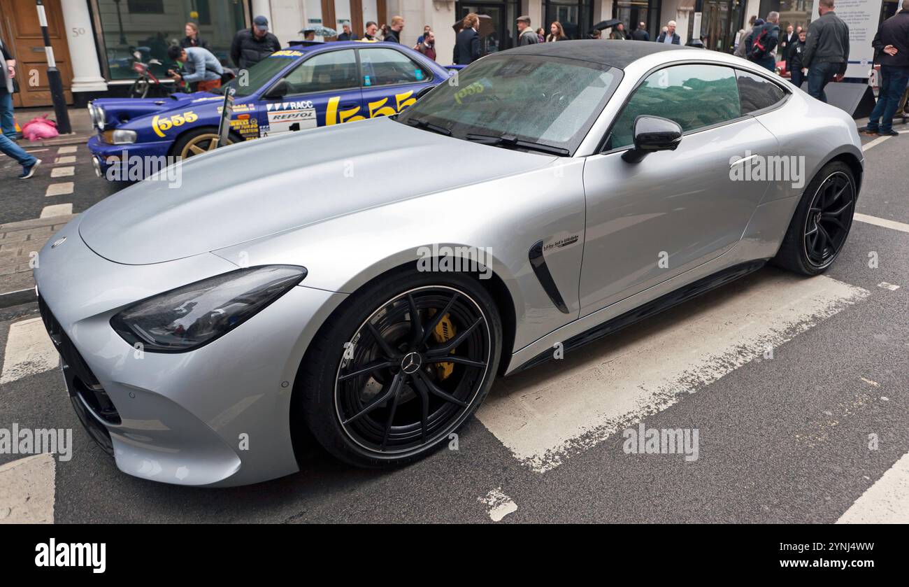 Three-quarter front view of the new Silver, 2024, Mercedes AMG Coupe ...