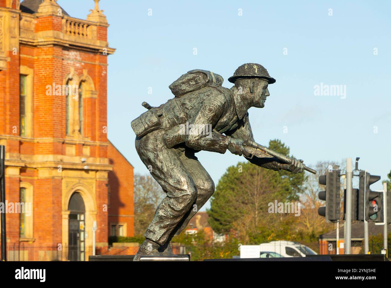 Stanley E. Hollis VC Memorial Statue of a soldier in action wearing a ...