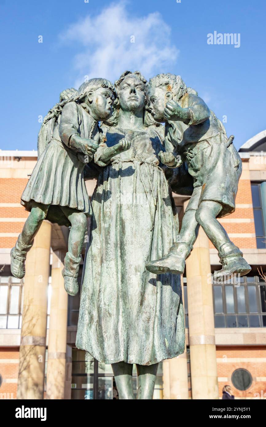 Statue depicting scales of justice with woman holding two quarreling ...