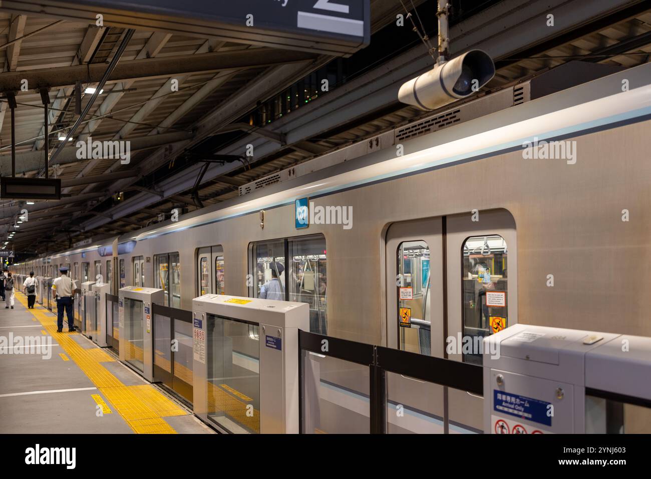 Modern Japanese Train Station at Night with Silver Train Stock Photo ...