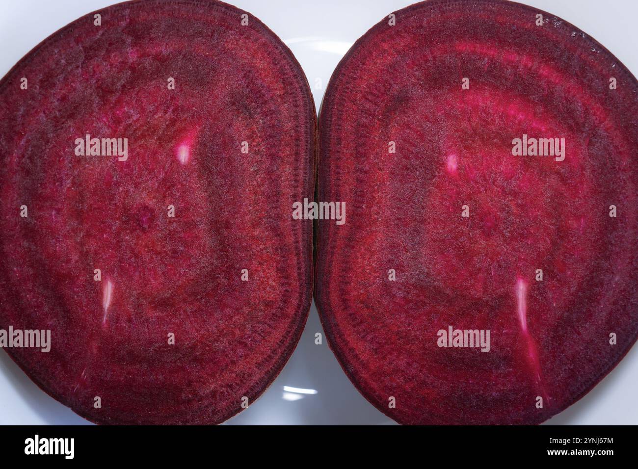 cut in half fresh beetroot top view close up Stock Photo - Alamy