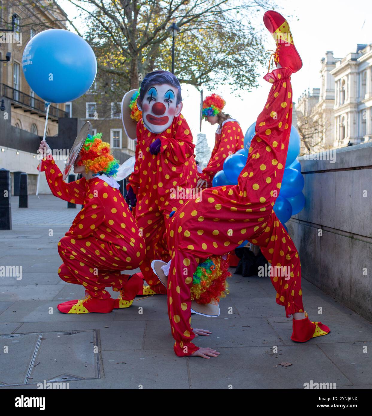 London, England, UK. 26th Nov, 2024. PETA activists dressed as clowns ...
