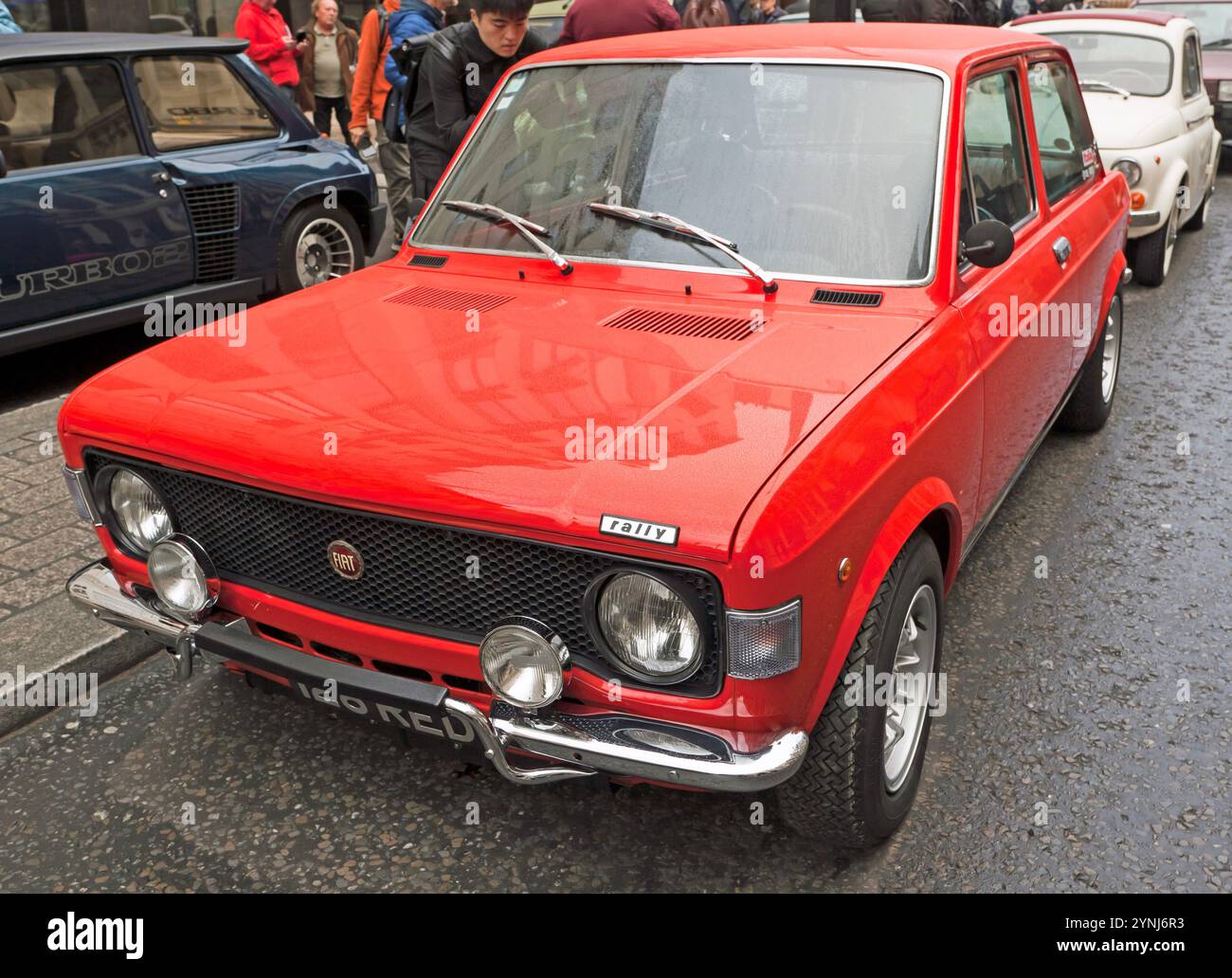 Three-quarters front view of a Red,1974, Fiat 128 Rally, on display in ...