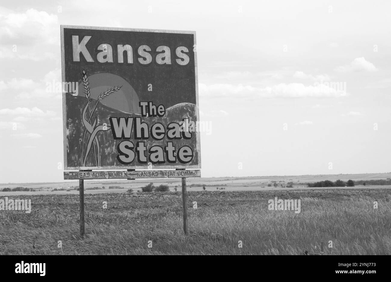 Welcome to Kansas, "The Wheat State" – a roadside welcome sign proudly ...