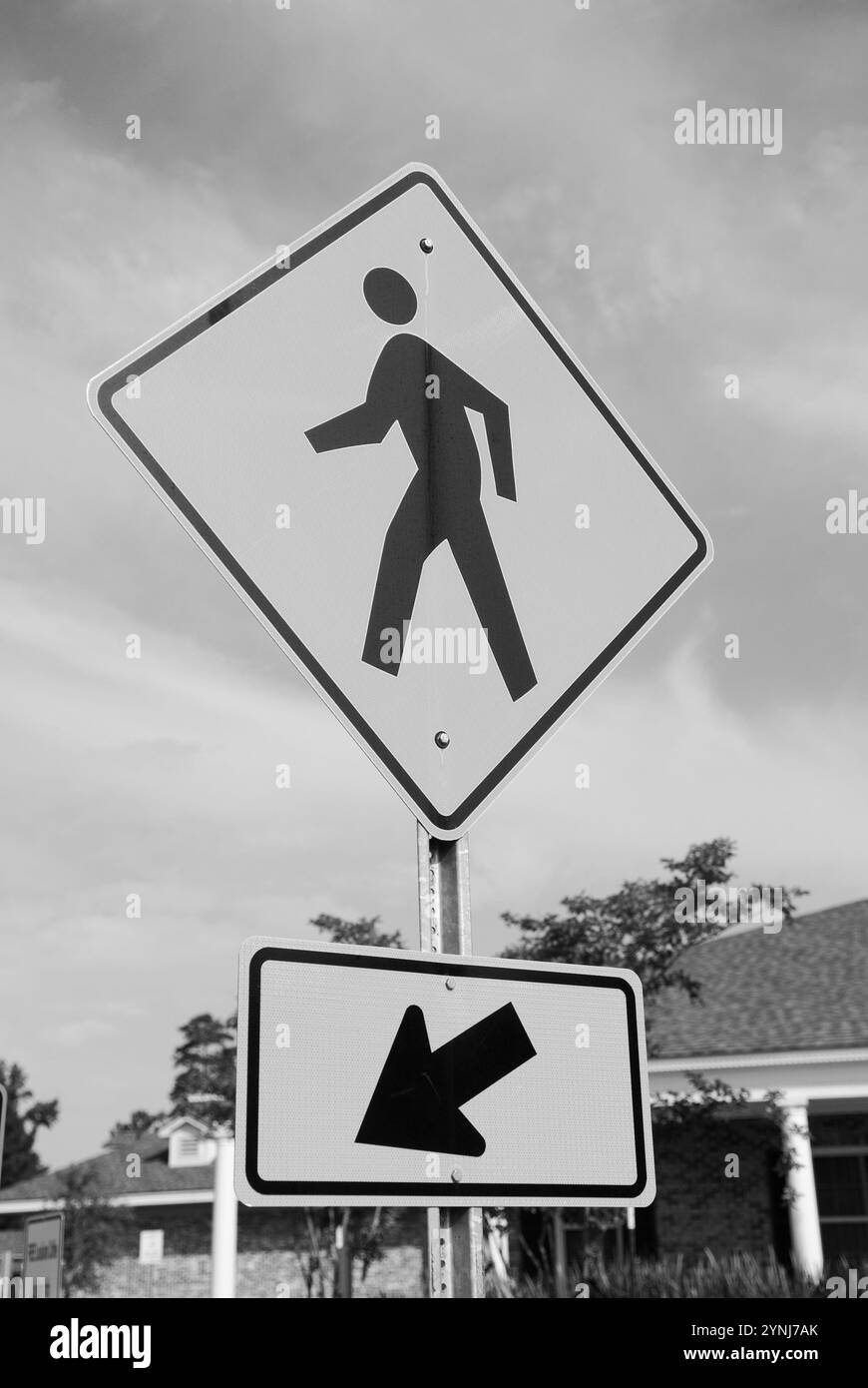 Pedestrian crosswalk sign on a sunny day in the USA, emphasizing road ...
