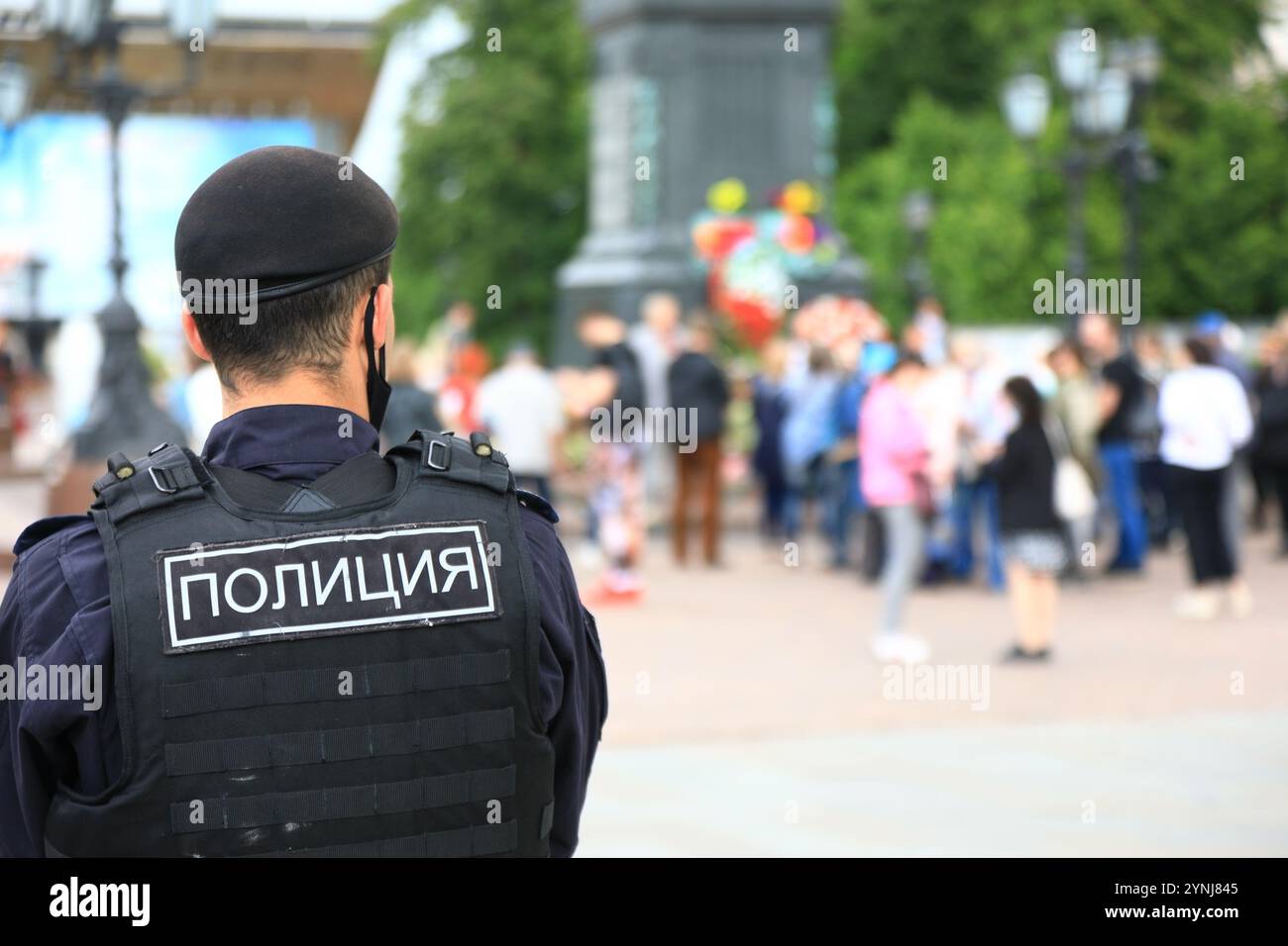 Russian unidentified police officer carefully watches the crowd of ...