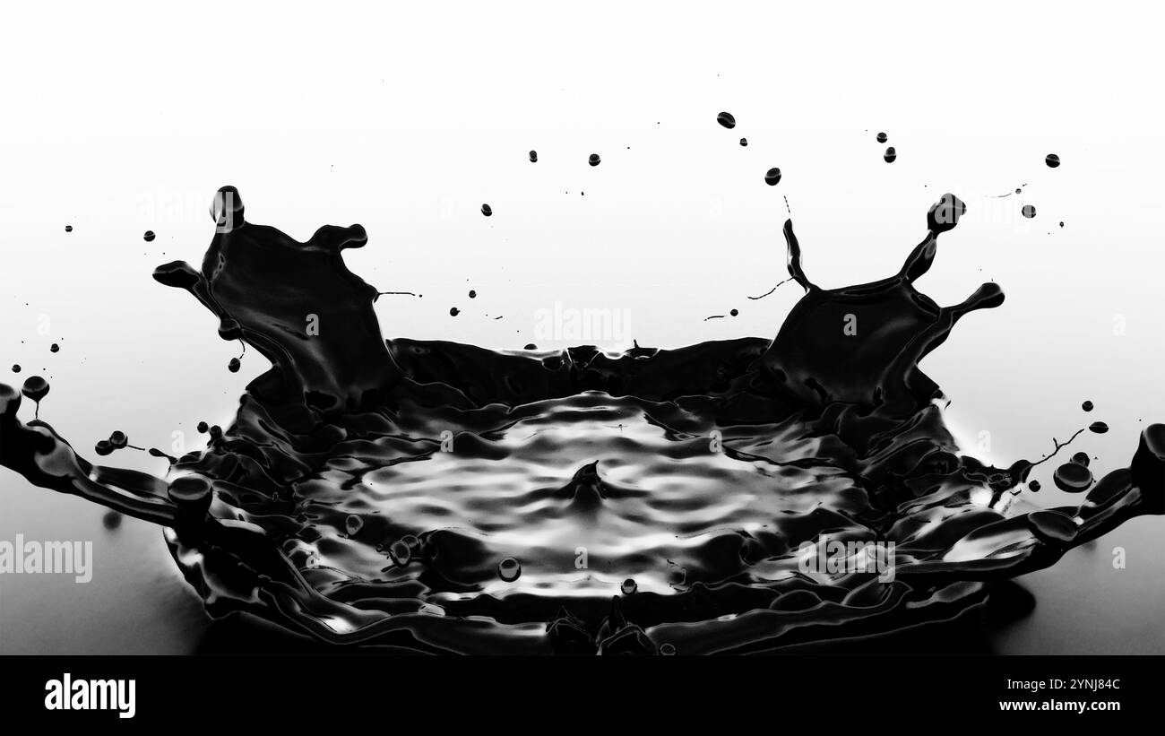 A black oil splash creating a crown shape on a reflective surface ...