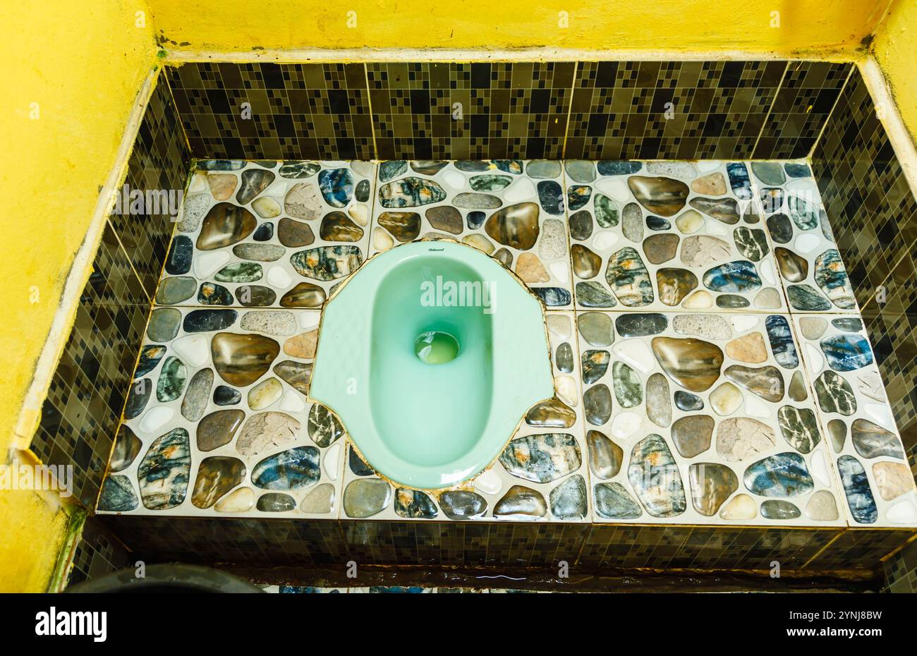 Typical clean, modern, ceramic squat hole toilet by Dolacera in Vang ...