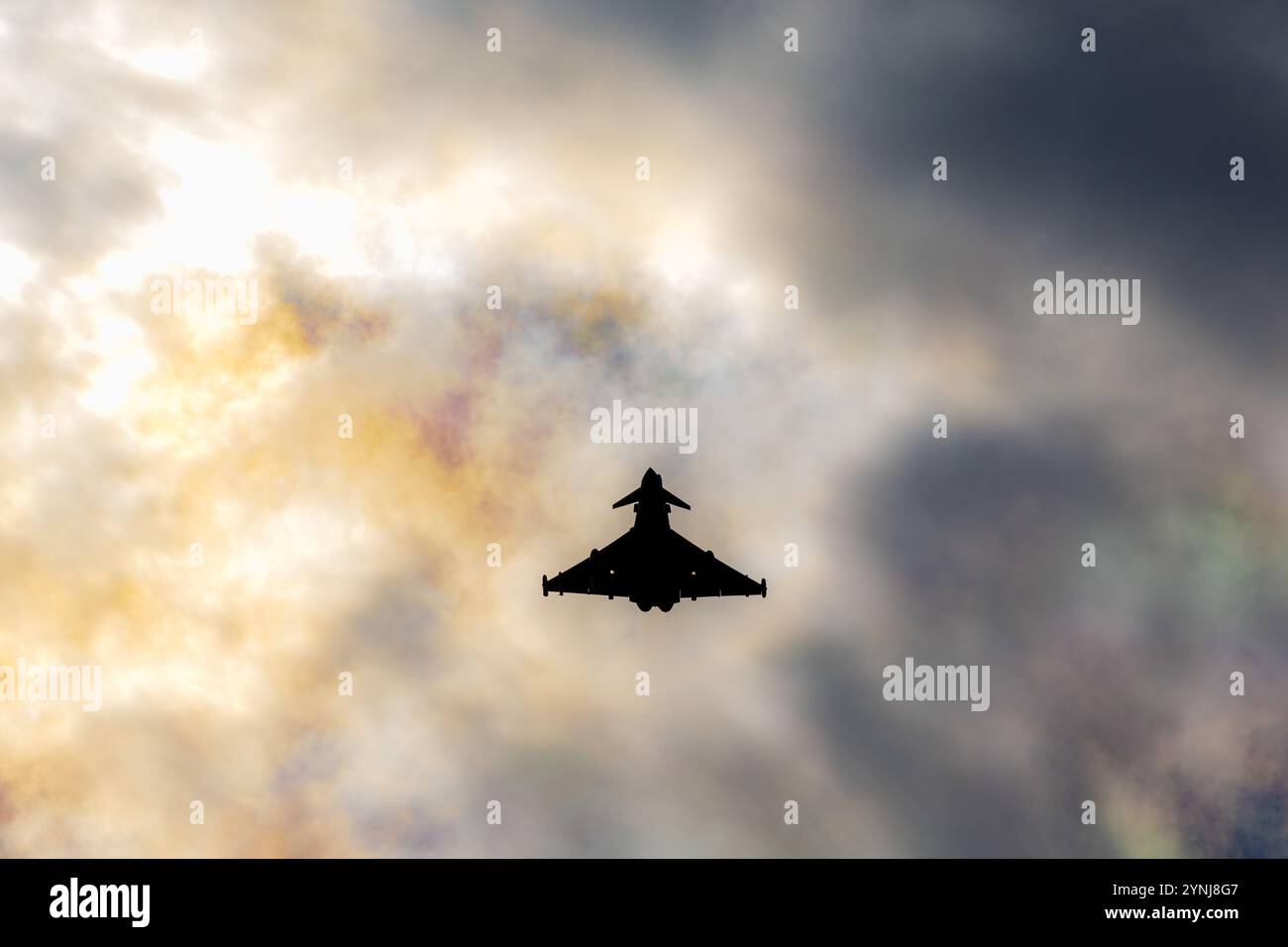A stunning silhouette of a Eurofighter Typhoon in flight, set against a ...