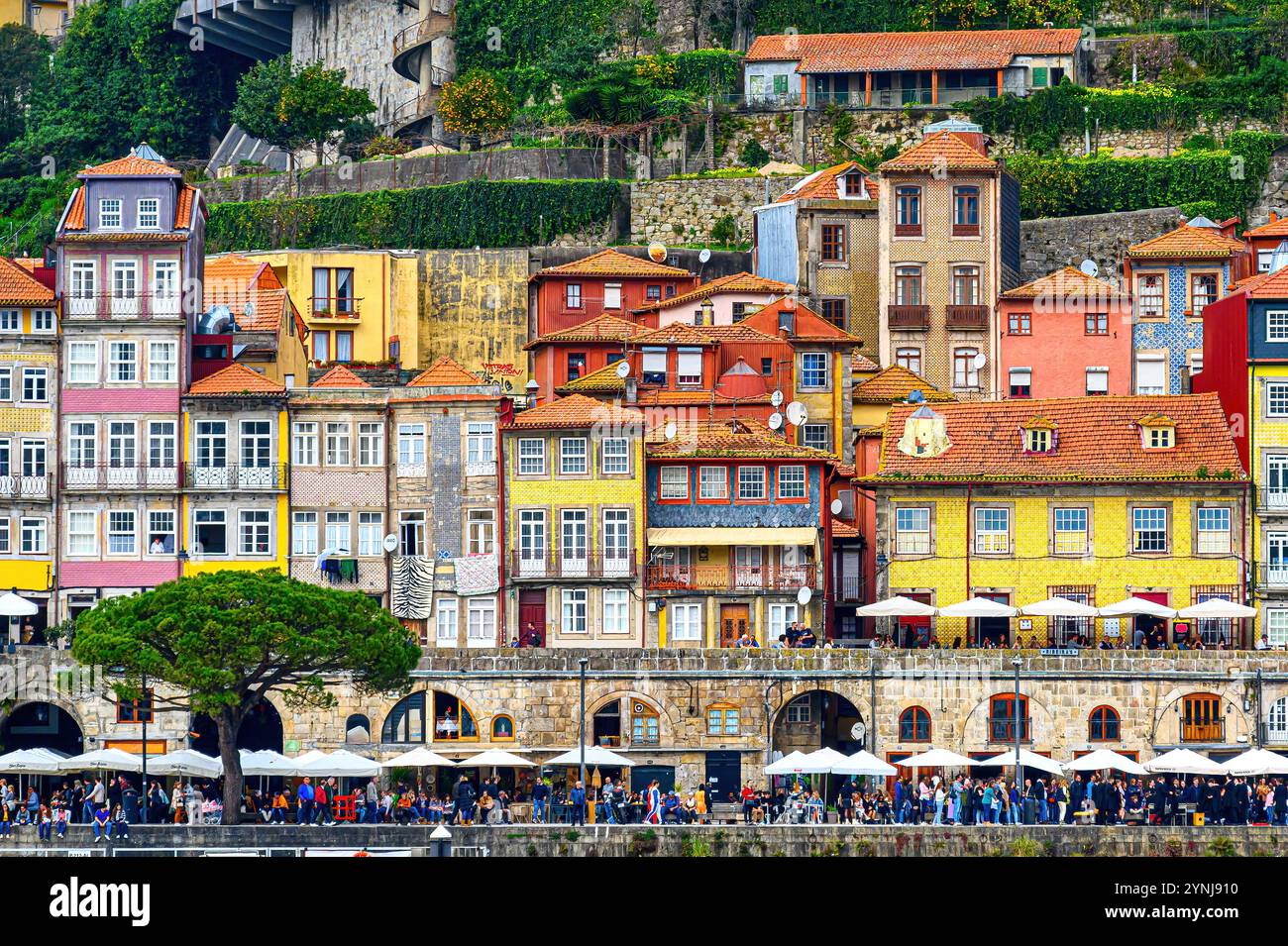 Porto, Portugal - July 17, 2024: People by the cityscape buildings in ...