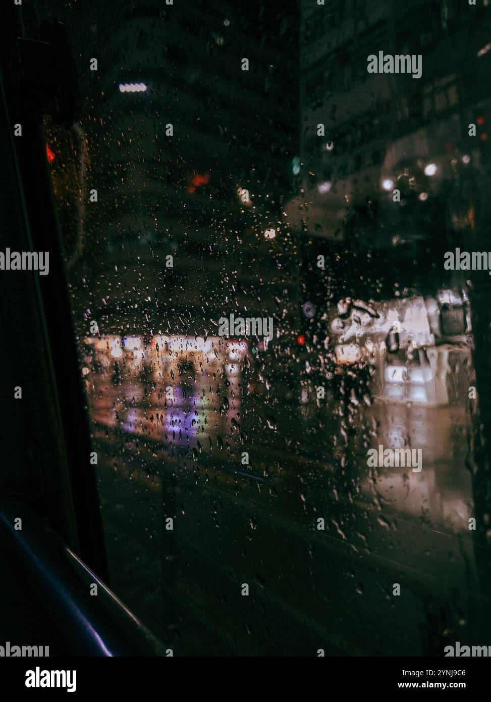 "Rain-Dappled Window Overlooking Blurred City Lights at Night ...