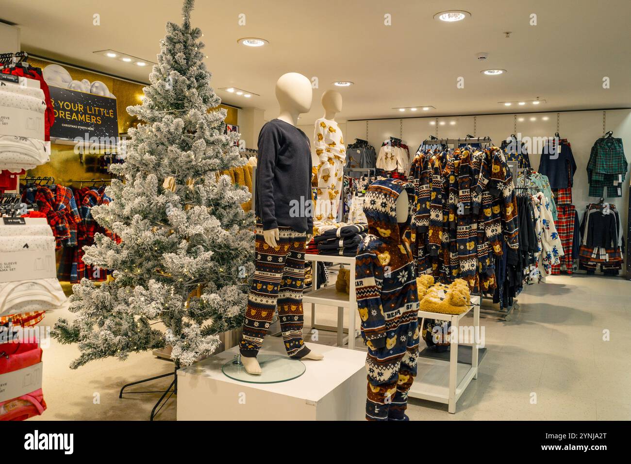Childrens Christmas clothing on display sale inside a Marks and Spencer ...
