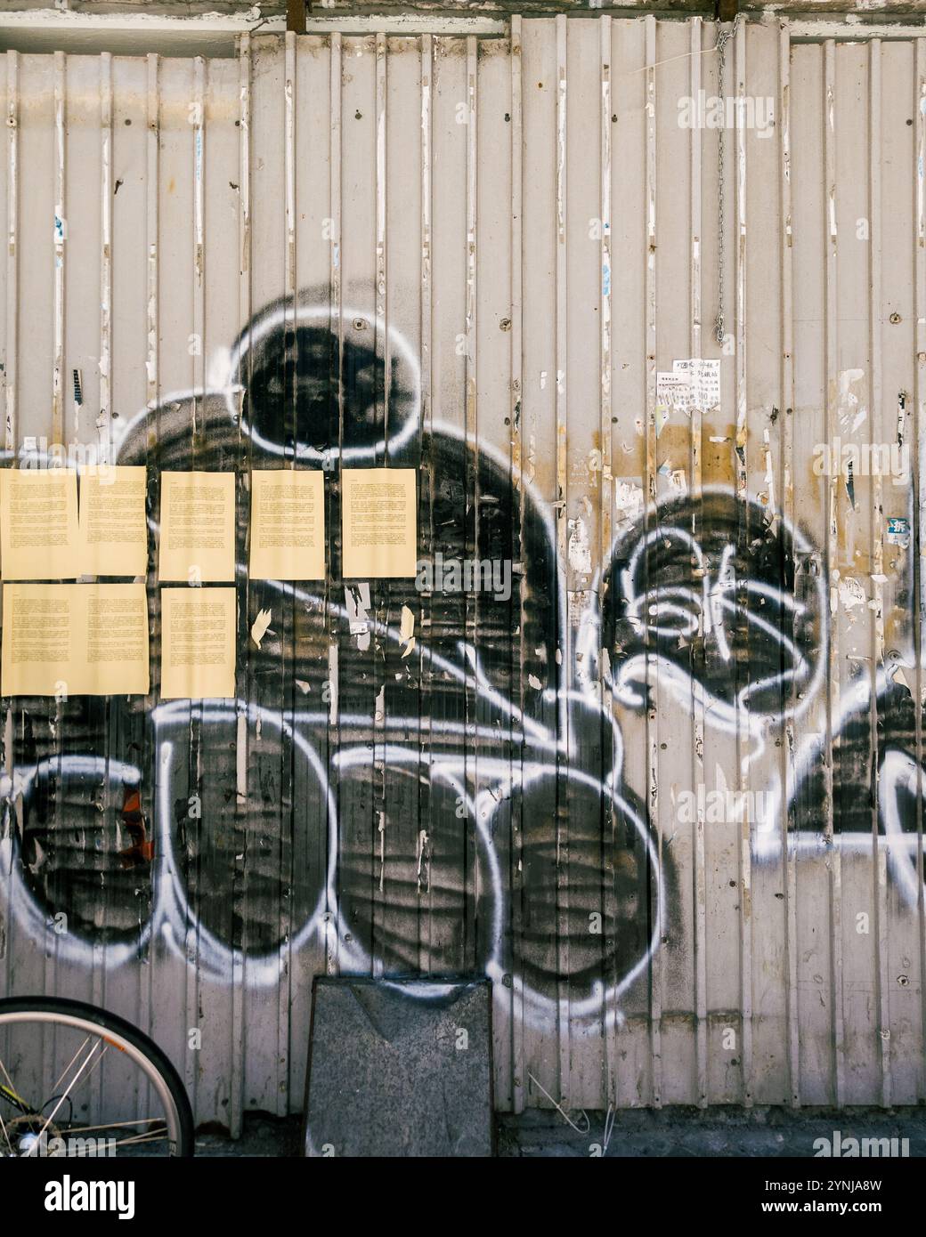 Urban Graffiti Art on Industrial Metal Wall with Yellow Notices and ...