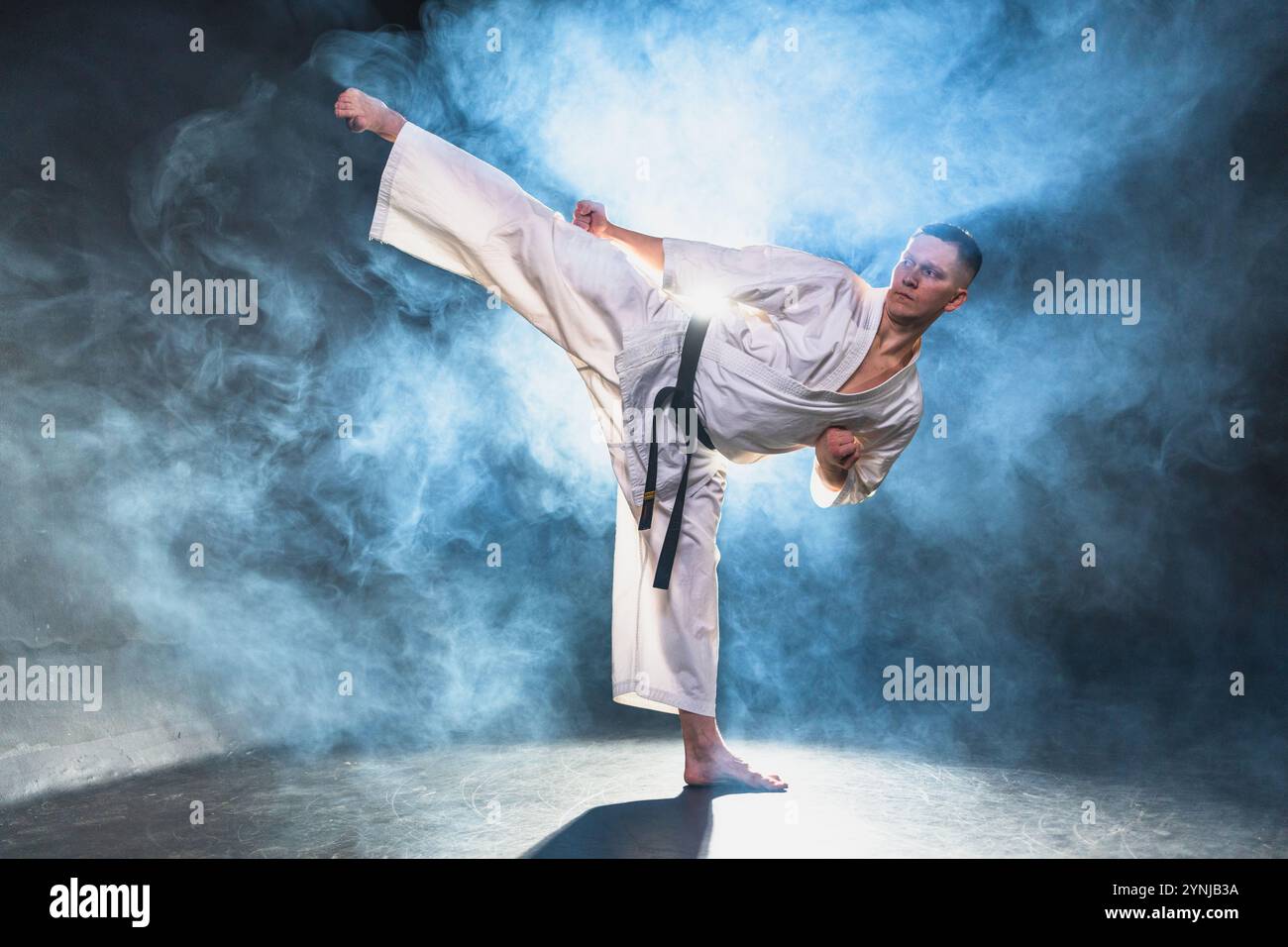 Strong man fighter in white kimono for karate martial arts with black ...