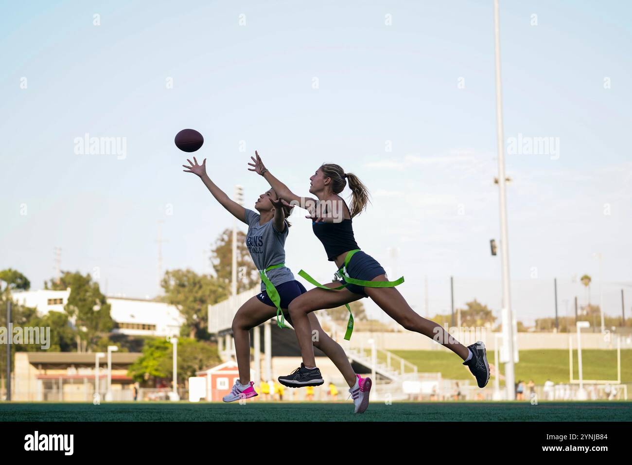 FILE - Syndel Murillo, 16, left, and Shale Harris, 15, reach for a pass ...