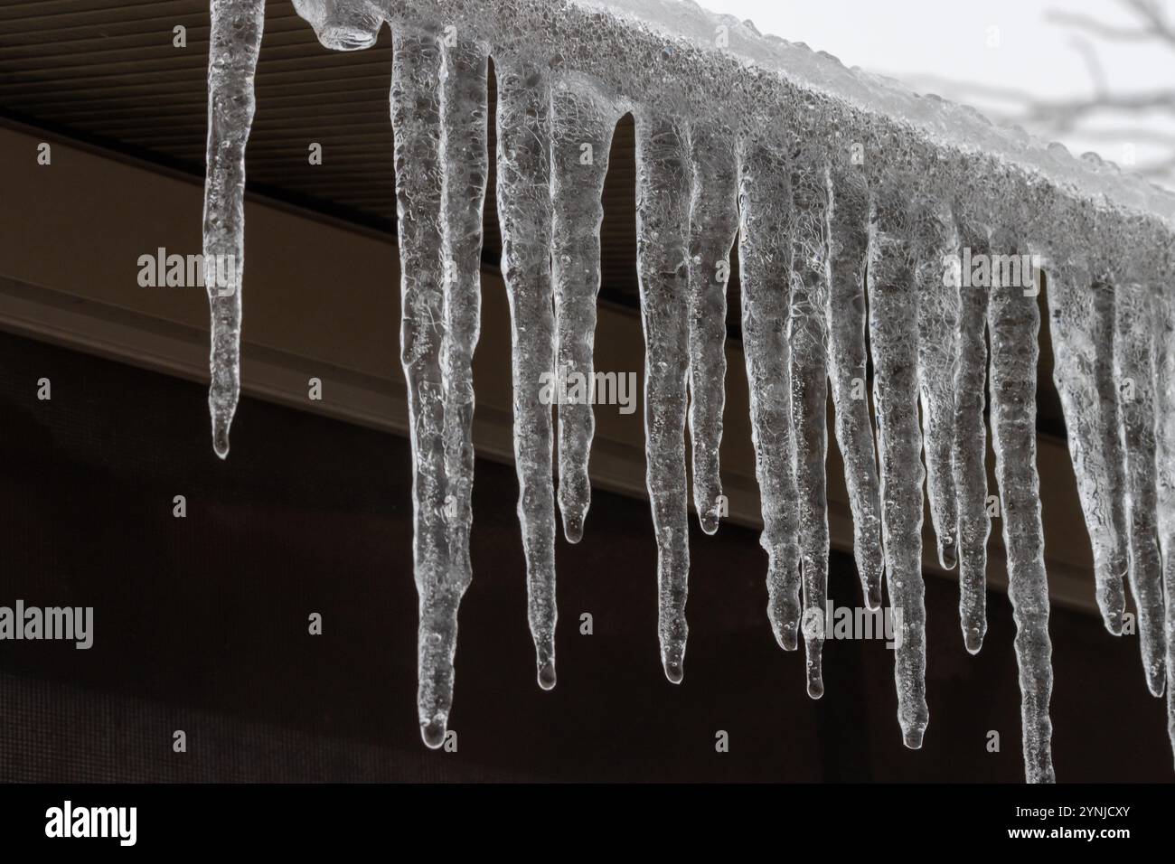 Icicles drip off a structure during a significant ice storm Stock Photo ...