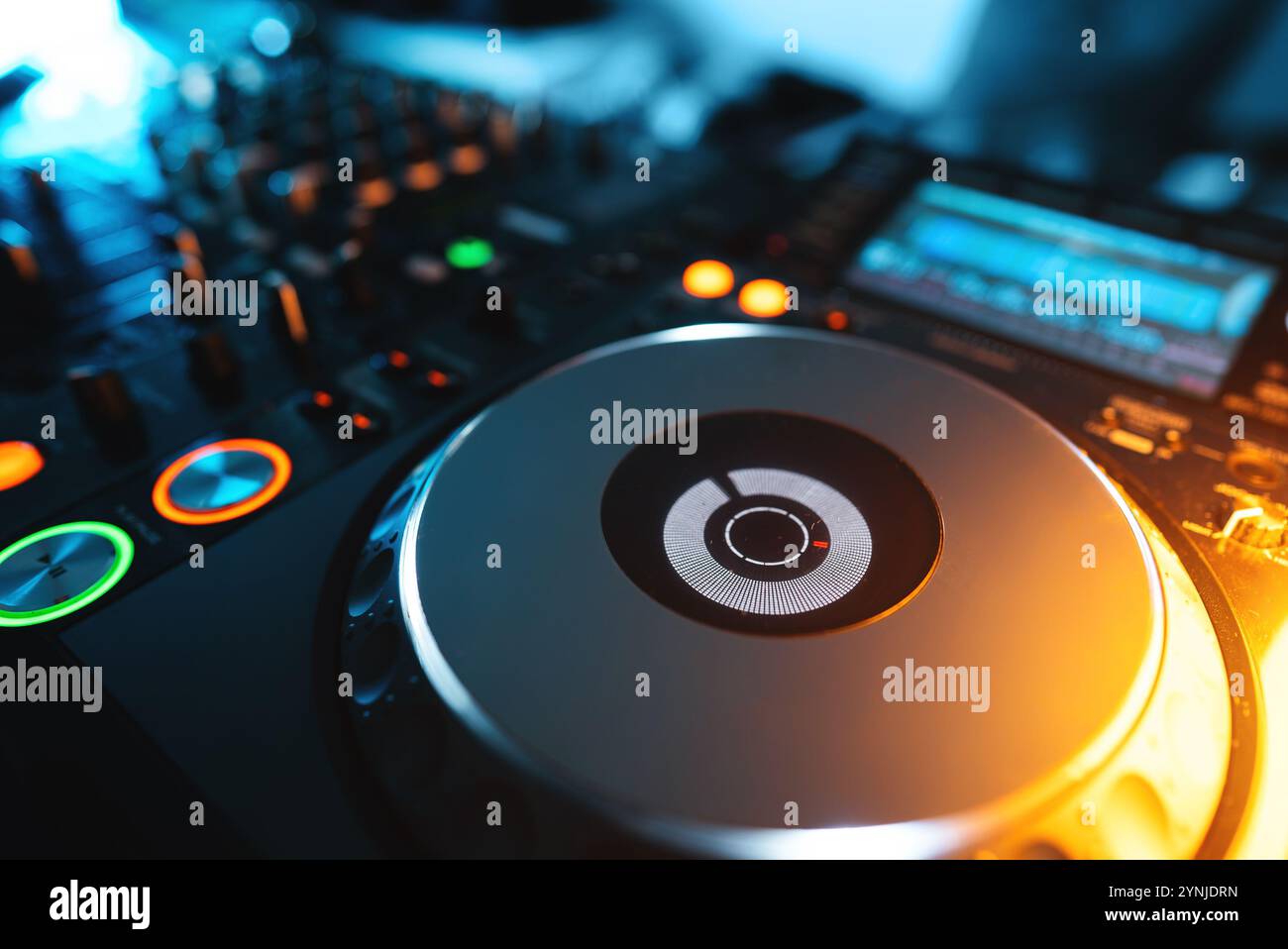 closeup of professional digital pioneer dj decks and audio mixer equipment ready for party in ...