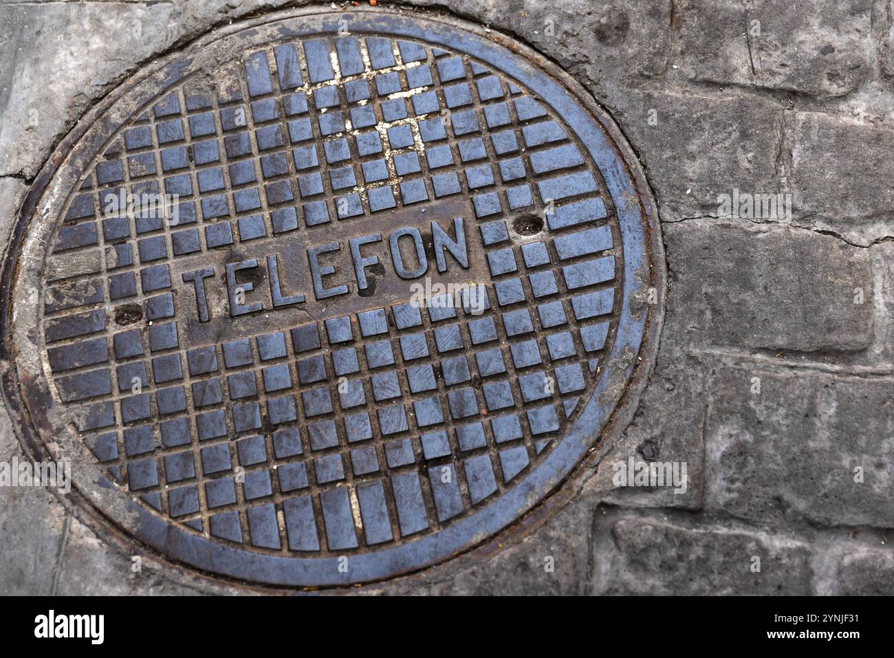 Round steel sewer manhole close-up photo, top view Stock Photo - Alamy
