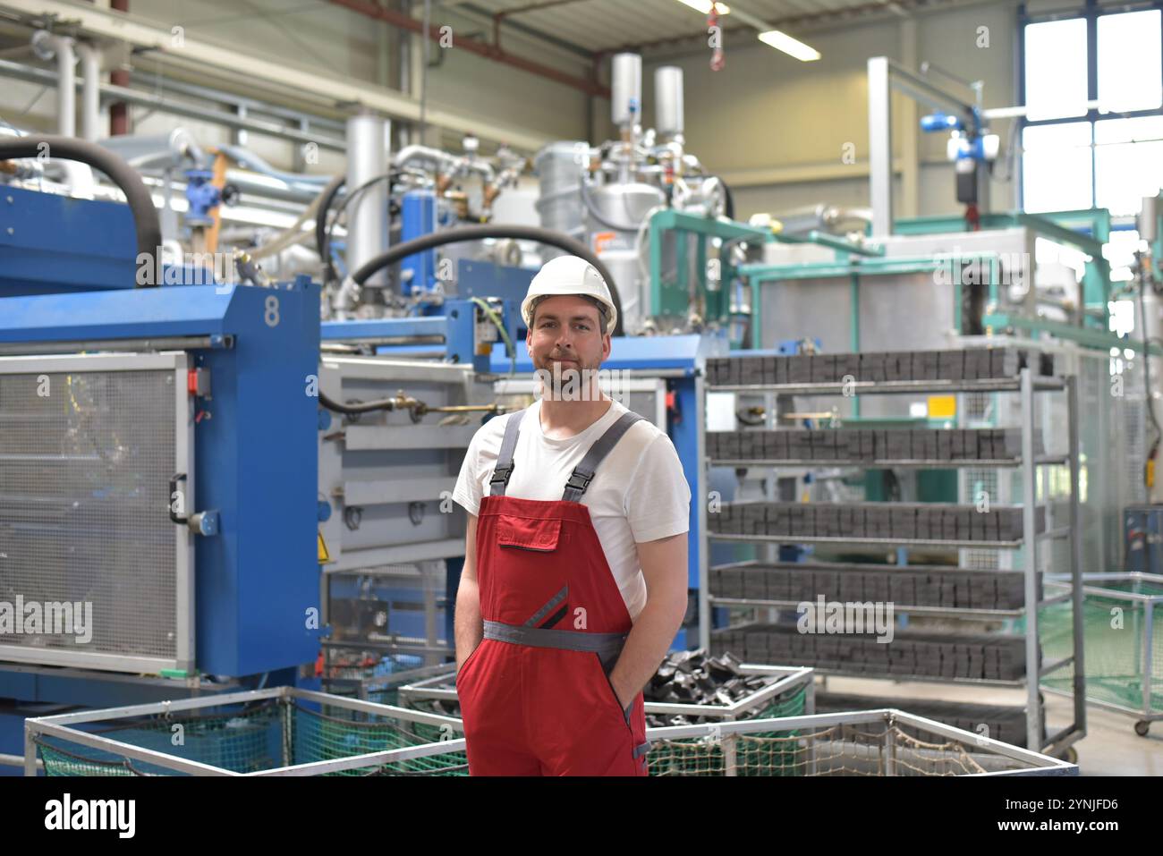 portrait of successful smiling workers/ engineers on site in an ...