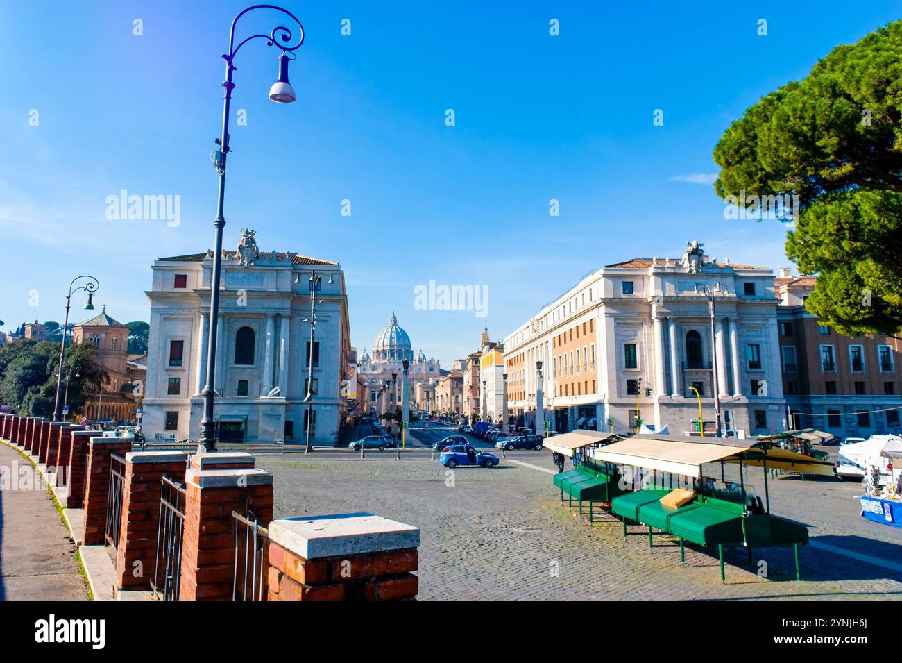 The small marketplace on Piazza Pia and huge dome of Saint Peter's ...