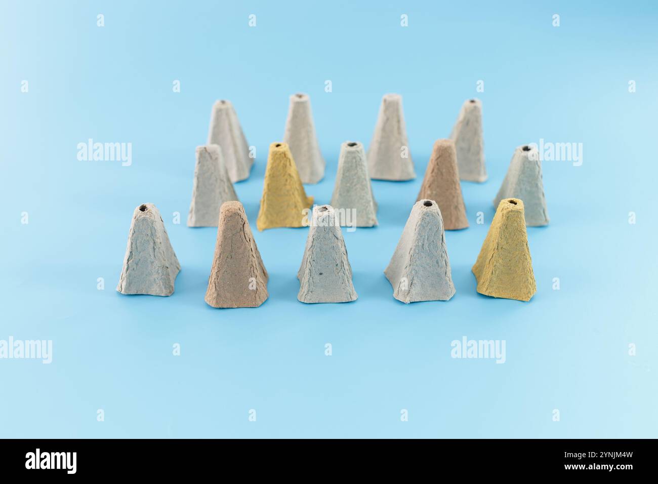 egg carton individual cone-shaped pieces are arranged in a row. egg ...