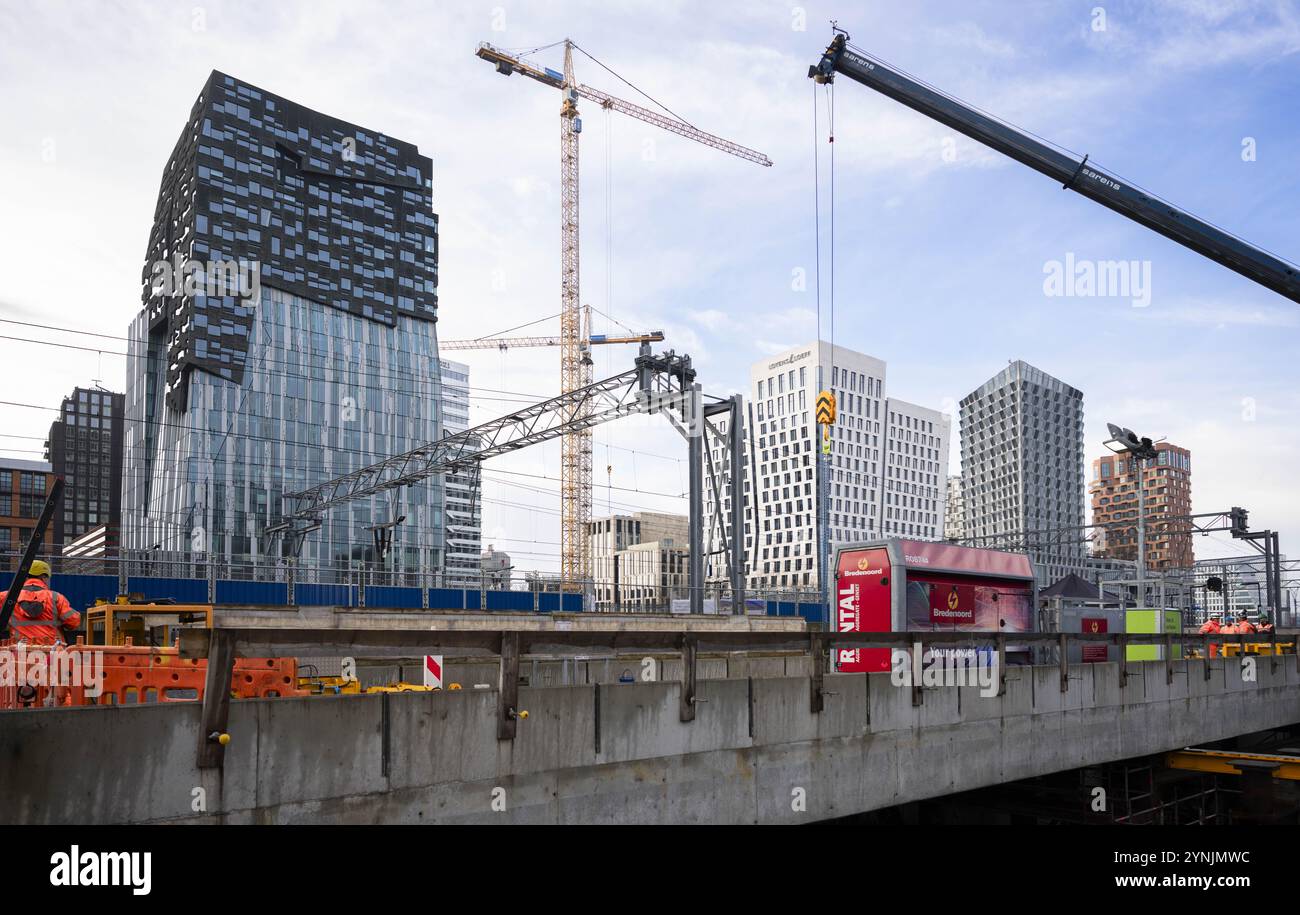AMSTERDAM - The roof section during the sliding into place of the final ...